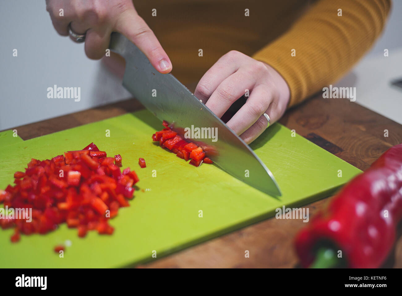 Cutting Red Peppers Stock Photo - Alamy