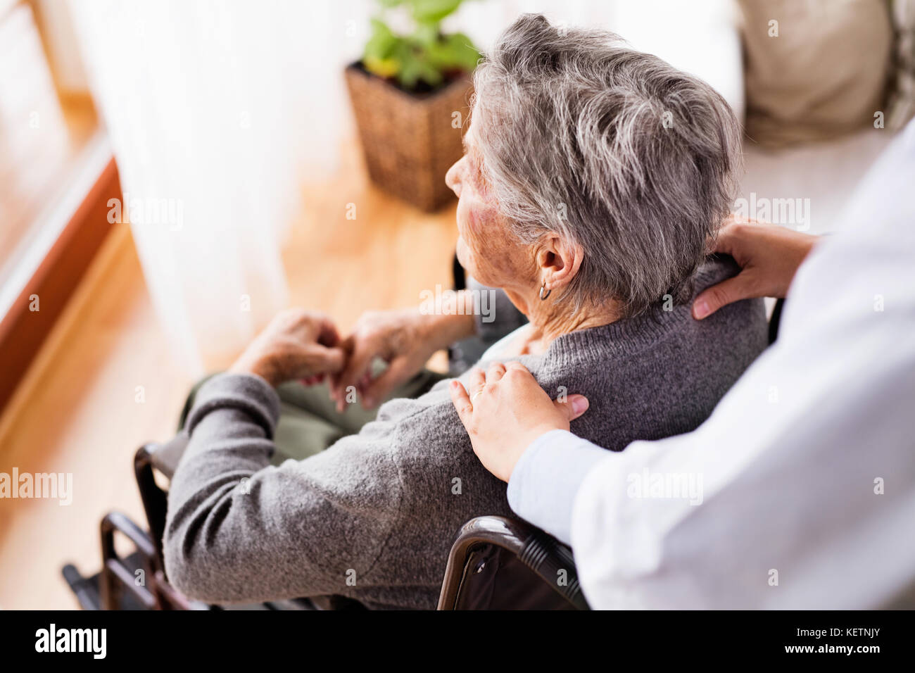 Health visitor and a senior woman during home visit Stock Photo - Alamy