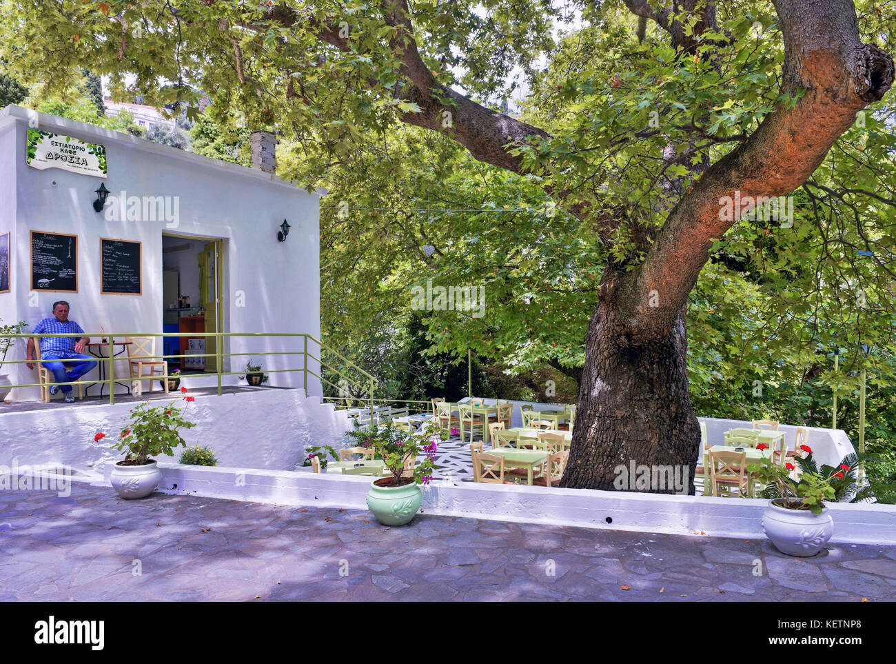 Menites village, the square and springs in Andros island, Cyclades ...