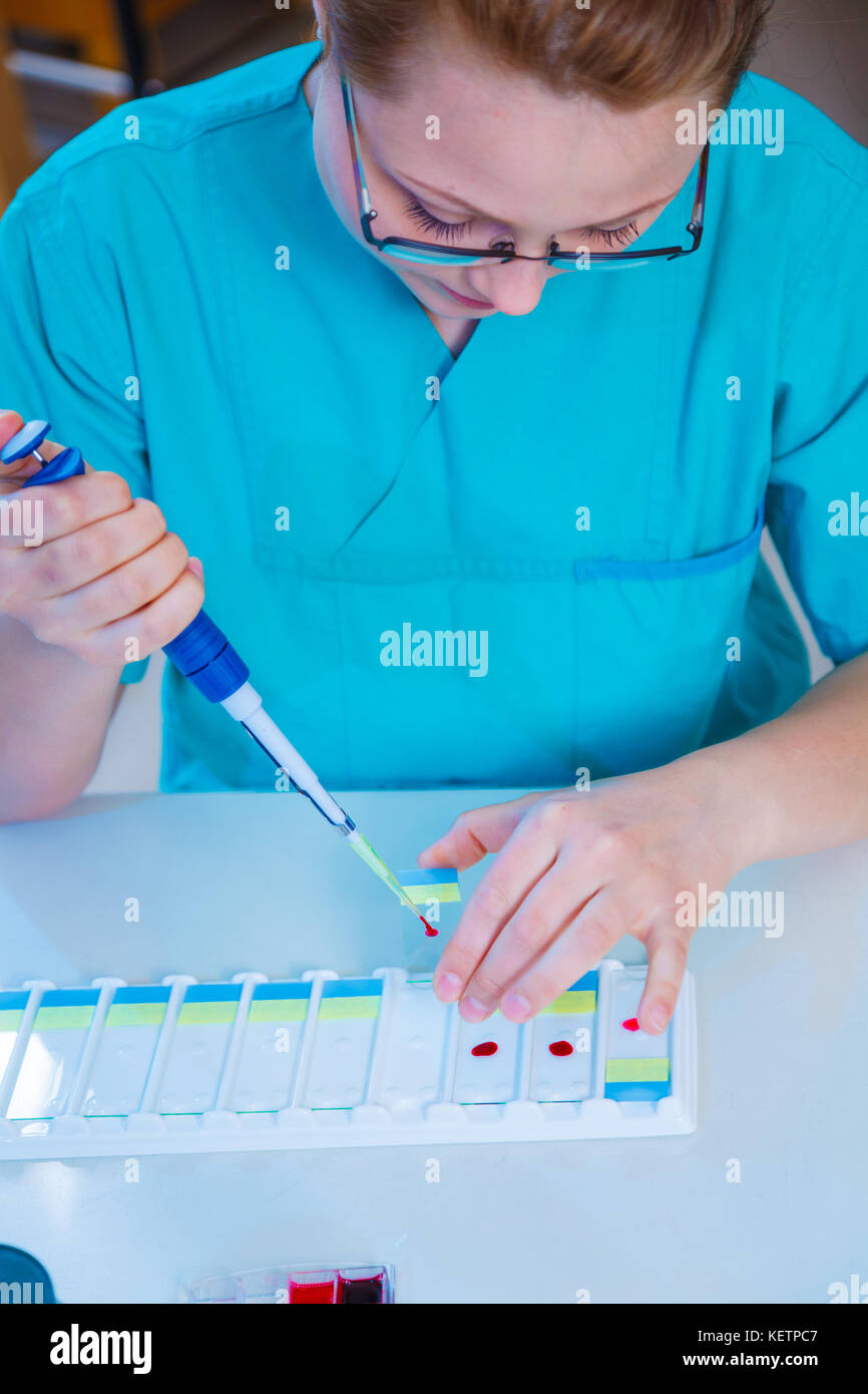 Nurse doing medical analysis Stock Photo - Alamy