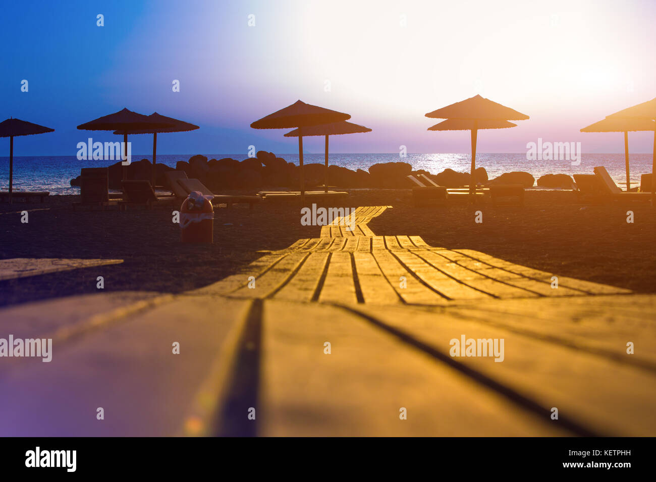 Wooden pavement on the beach at sunset time Stock Photo - Alamy