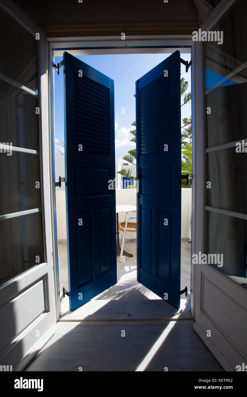 Blue door and window with shutters Stock Photo - Alamy
