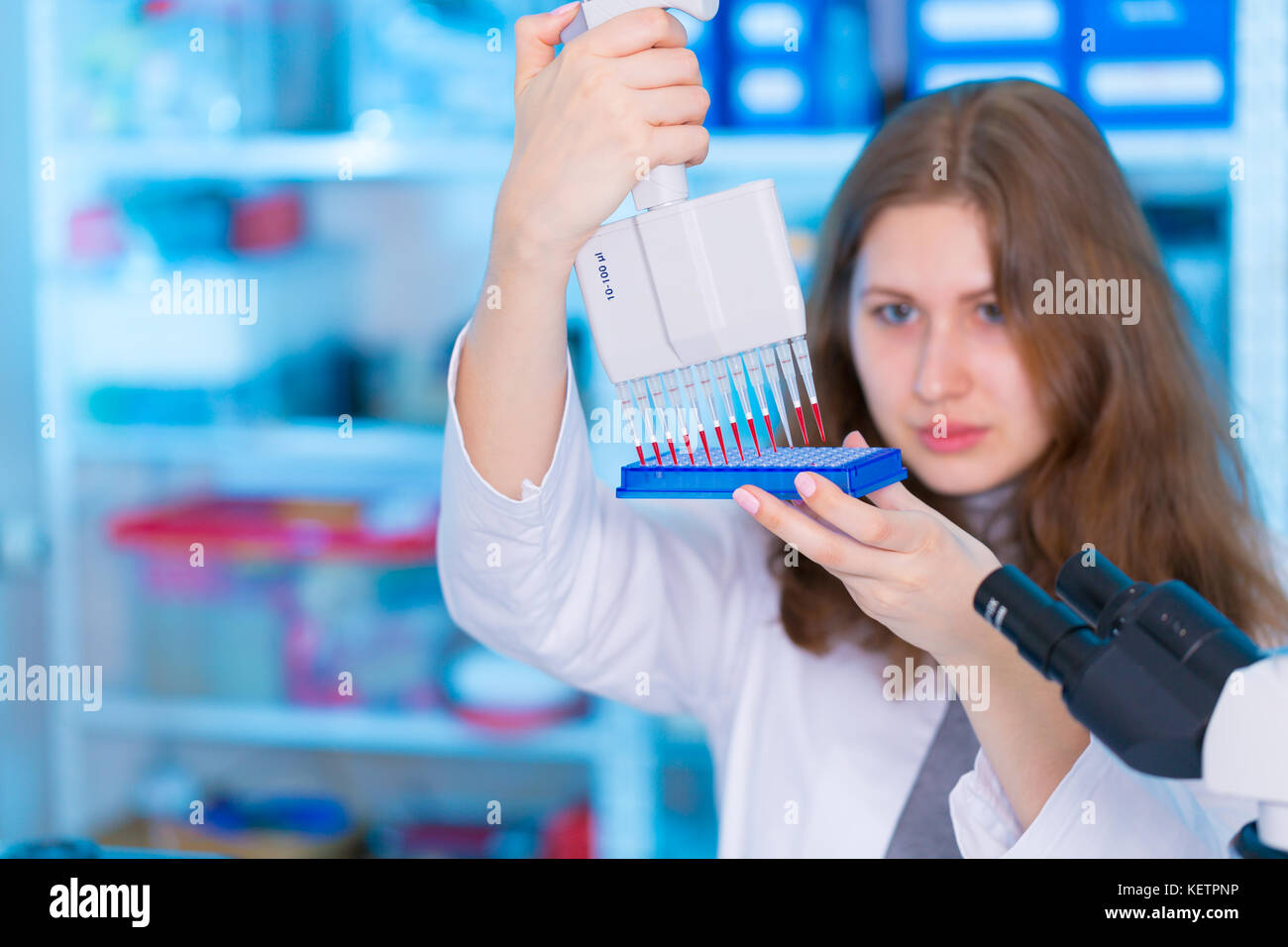 laboratory female assistant with pipette Stock Photo - Alamy