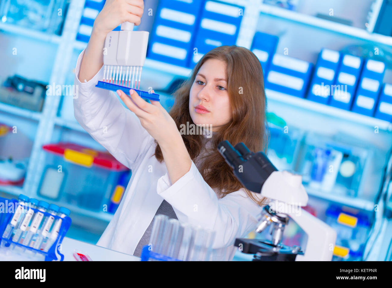 laboratory female assistant with pipette Stock Photo - Alamy
