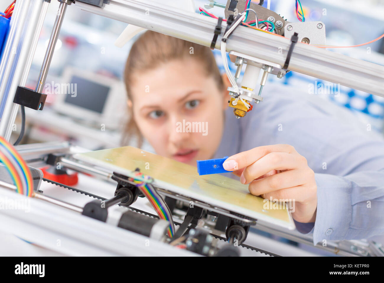 A female student or laboratory assistant in the automation laboratory ...