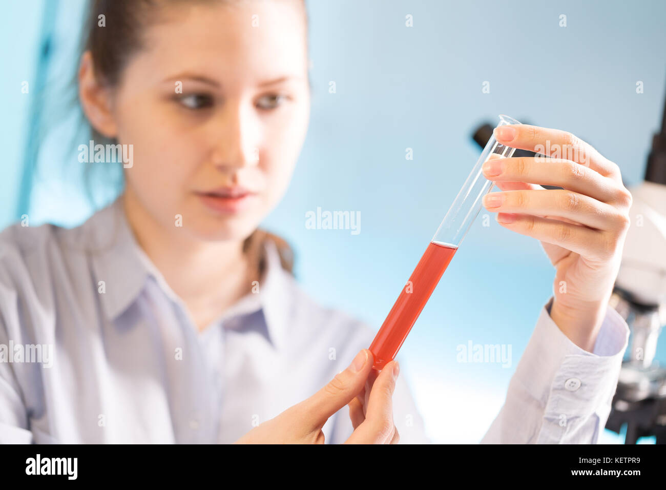 Student with test tube Stock Photo - Alamy