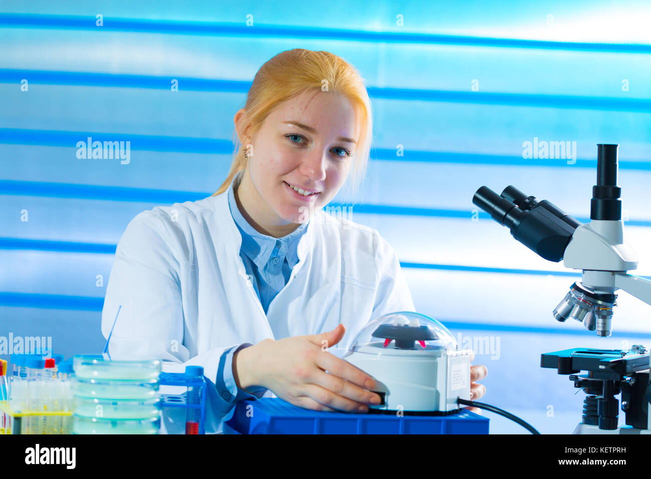 scientist woman laboratory centrifuge end pcr test tubes. Scientist ...