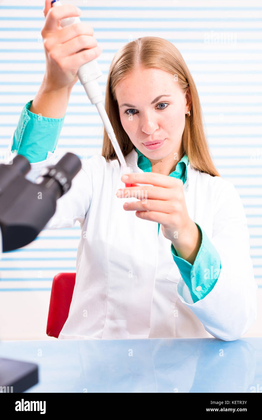 A nurse in a hospital laboratory tests a blood Stock Photo - Alamy