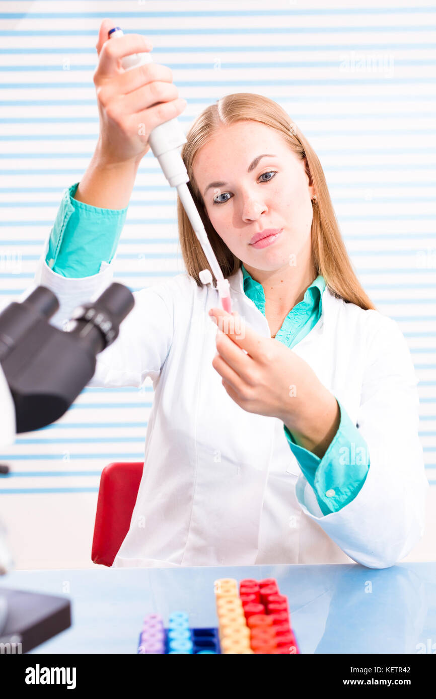 A nurse in a hospital laboratory tests a blood Stock Photo - Alamy