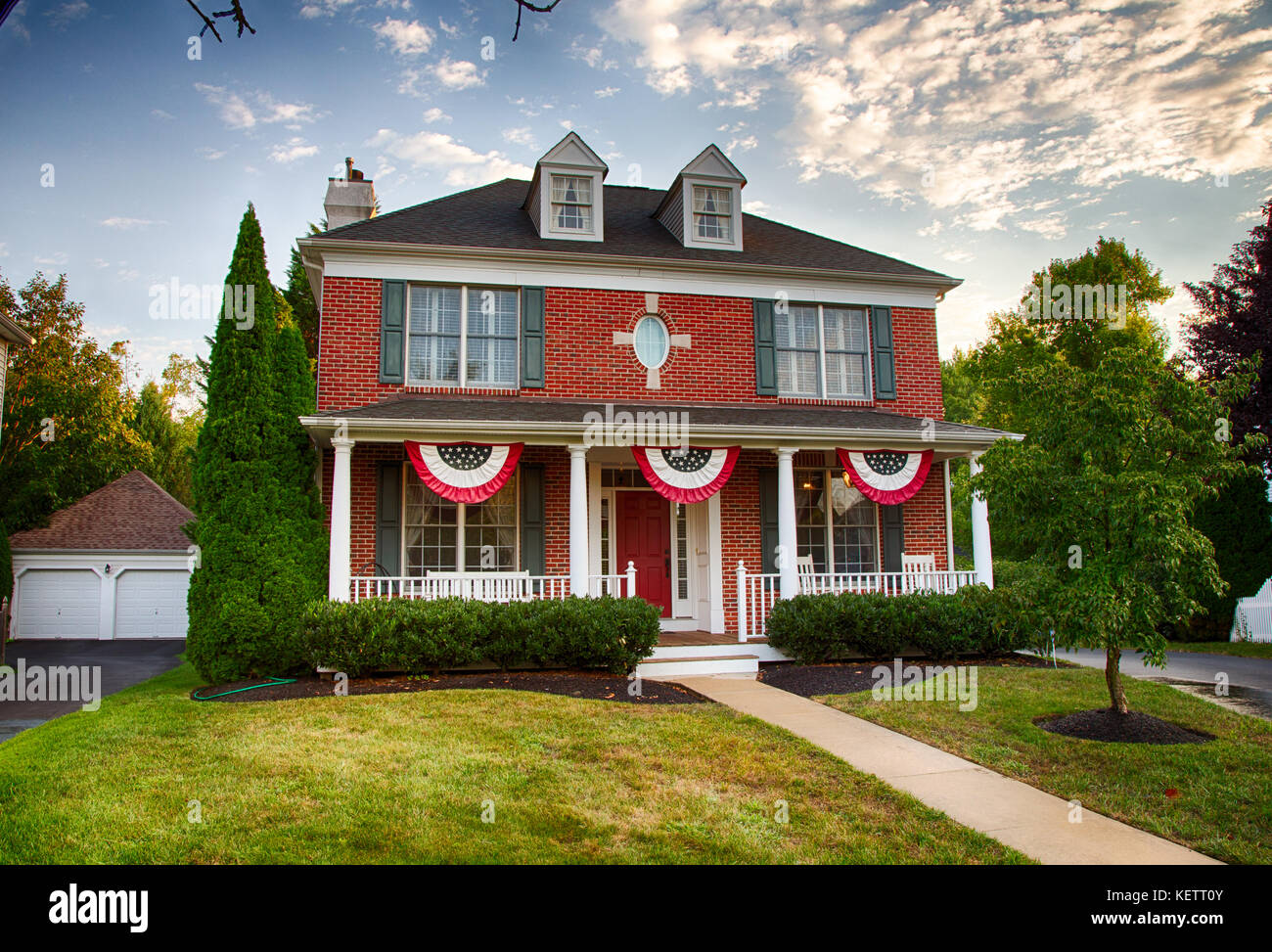A colonial house in Medford, New Jersey with American Flag buntings on ...