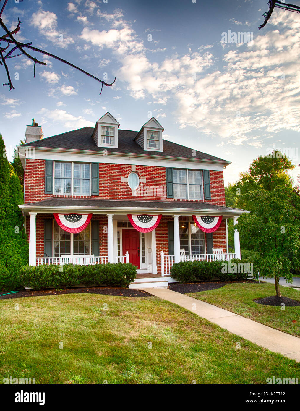 A colonial house in Medford, New Jersey with American Flag buntings on ...