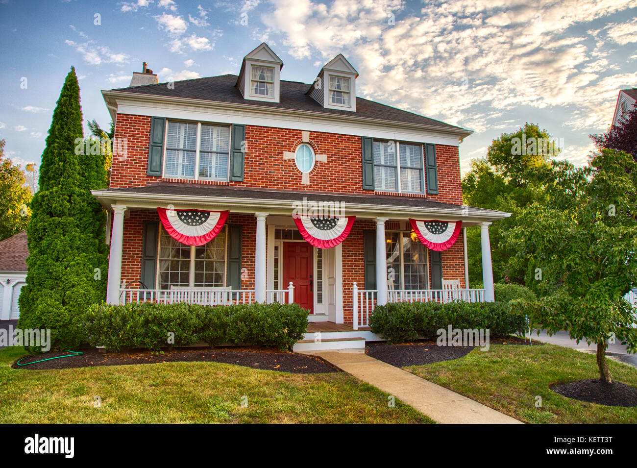 A colonial house in Medford, New Jersey with American Flag buntings on ...