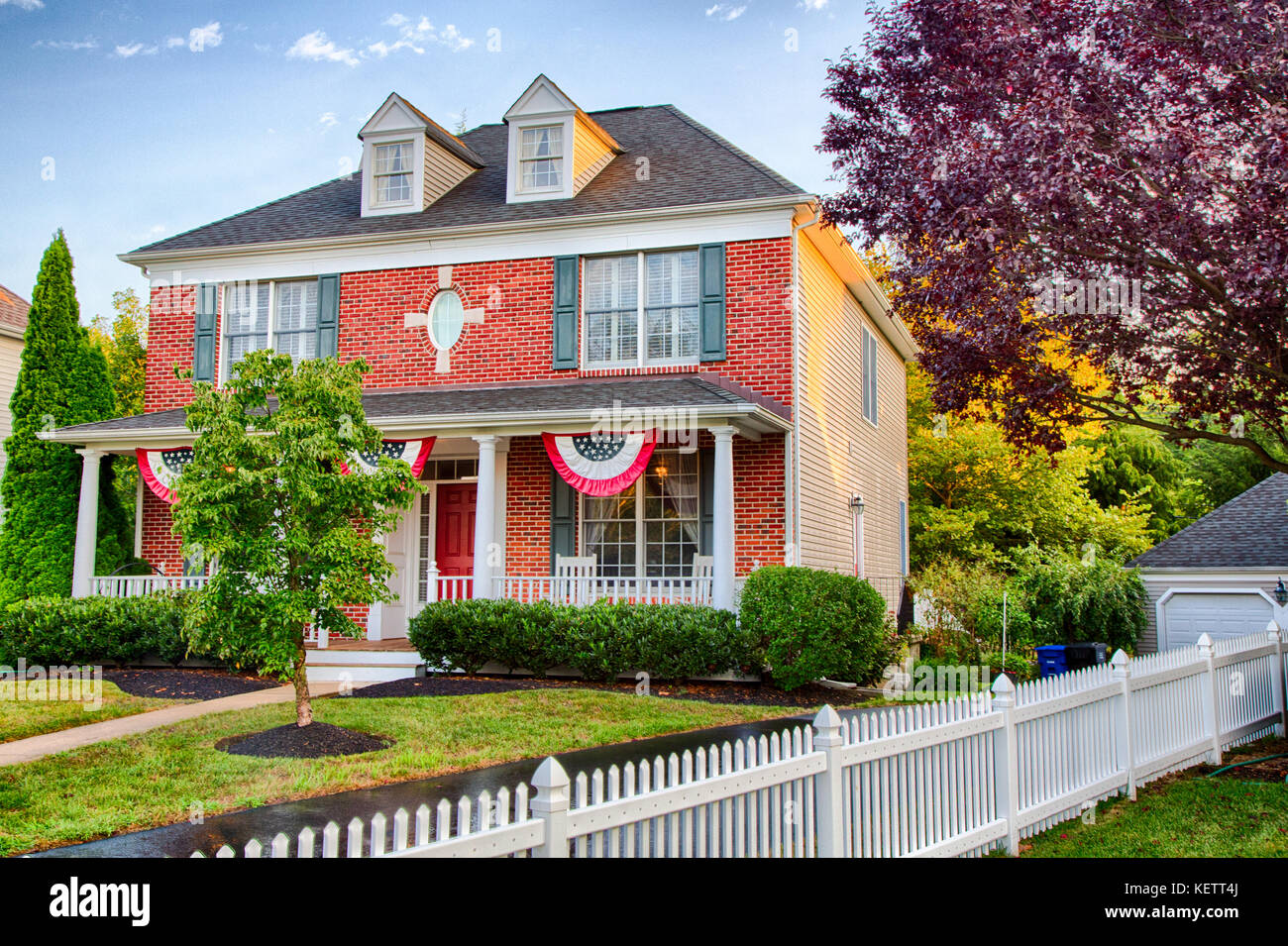 A colonial house in Medford, New Jersey with American Flag buntings on ...