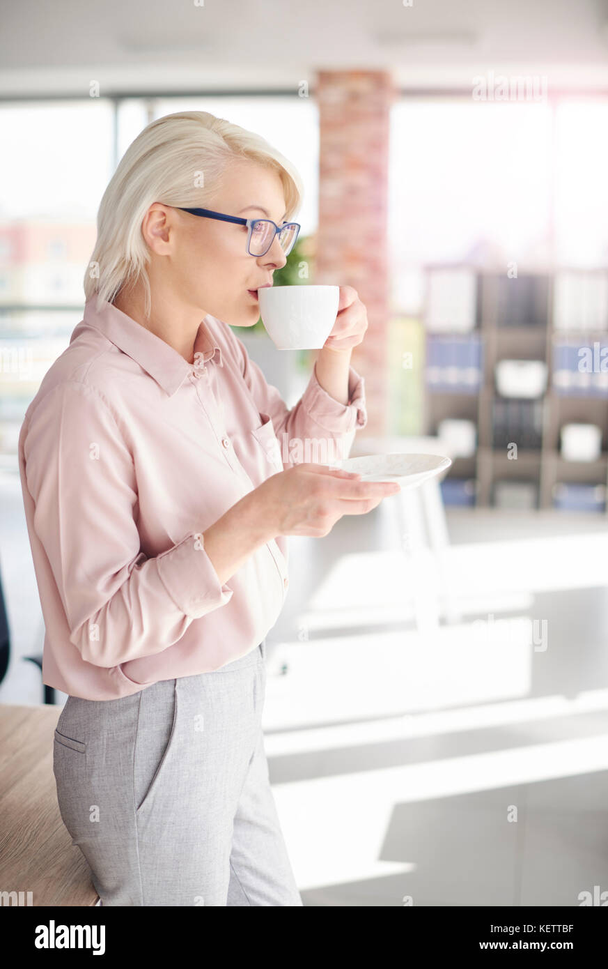 Employee having a coffee at work Stock Photo - Alamy