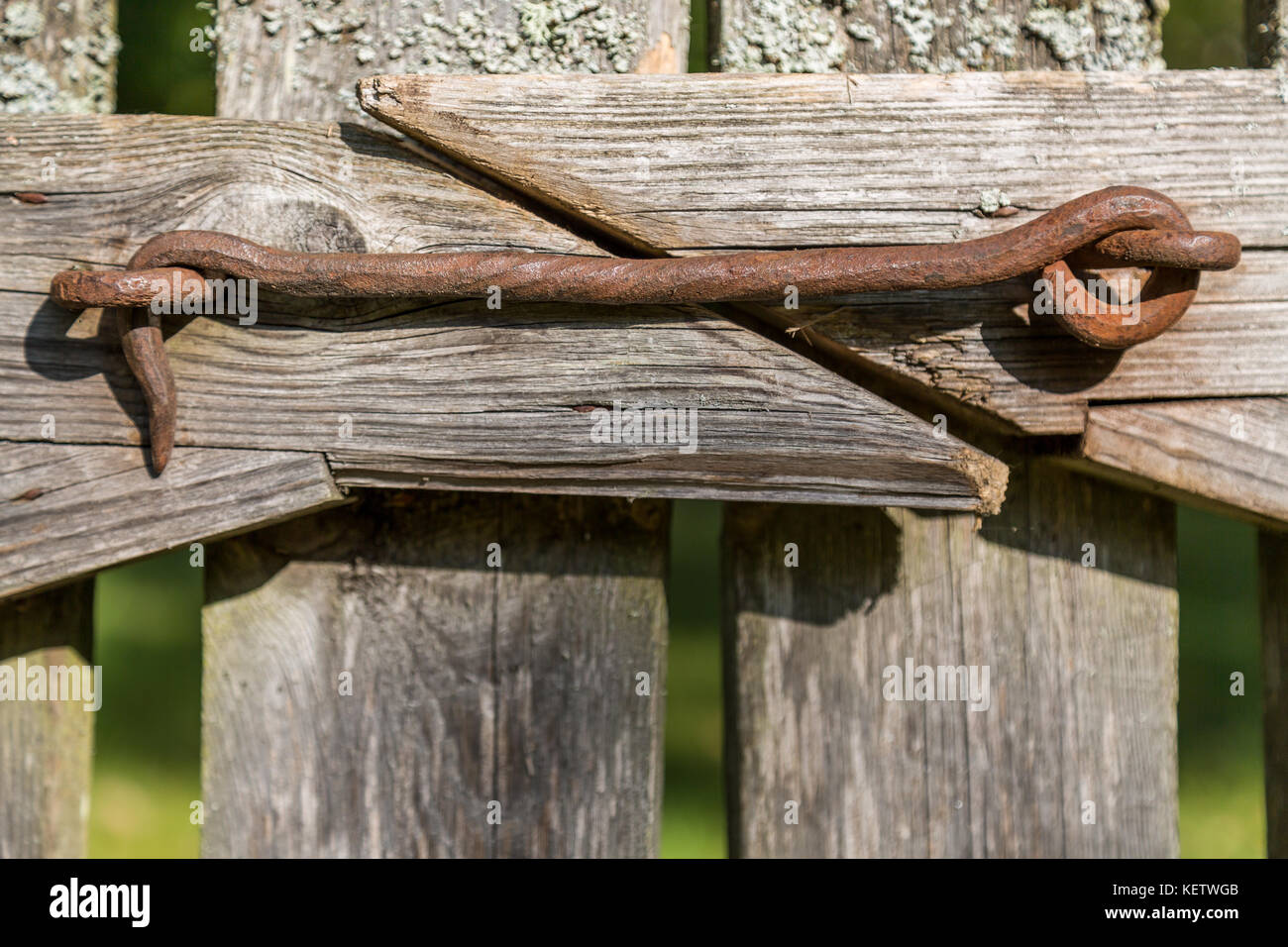 Old Metal lock on wooden fence Stock Photo - Alamy