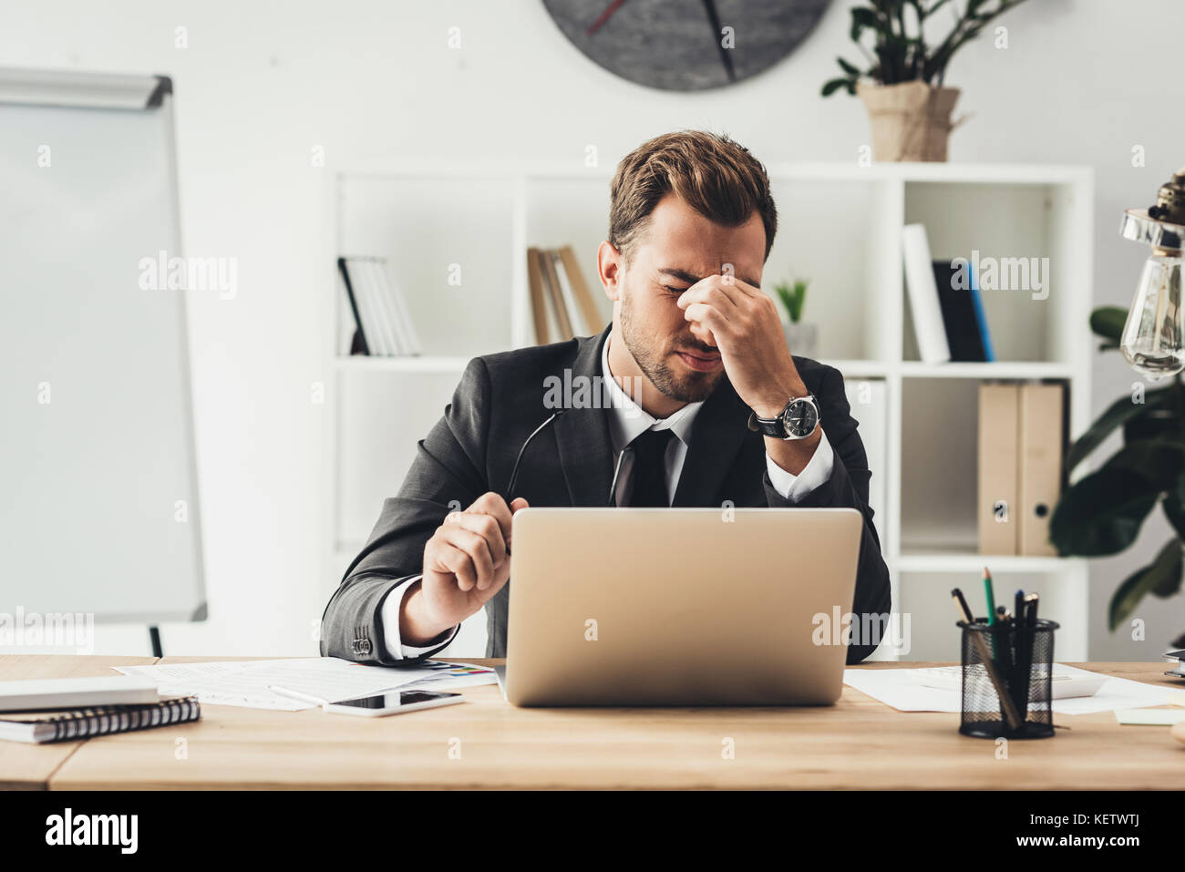 tired businessman at workplace Stock Photo - Alamy