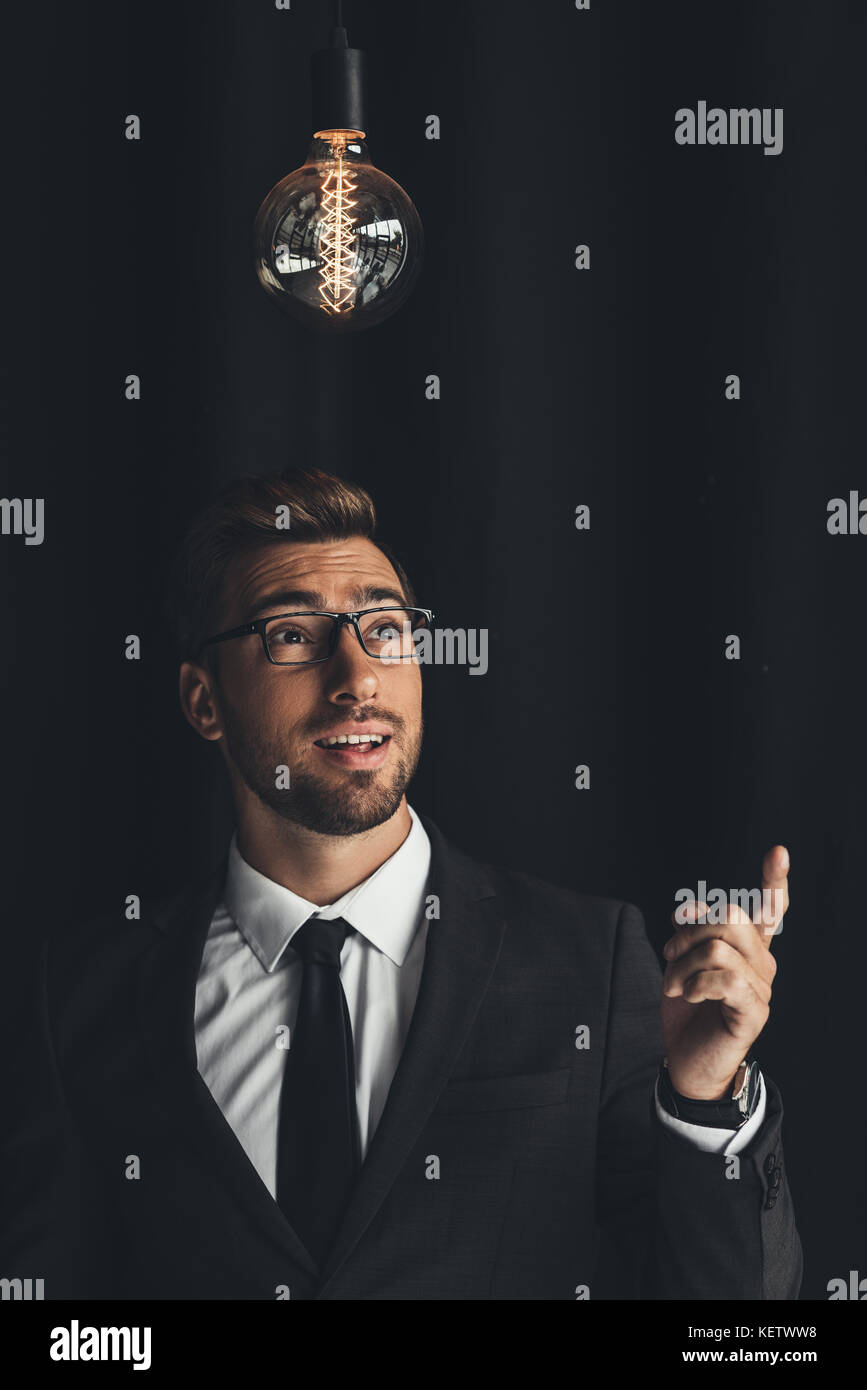 handsome businessman with lightbulb Stock Photo - Alamy