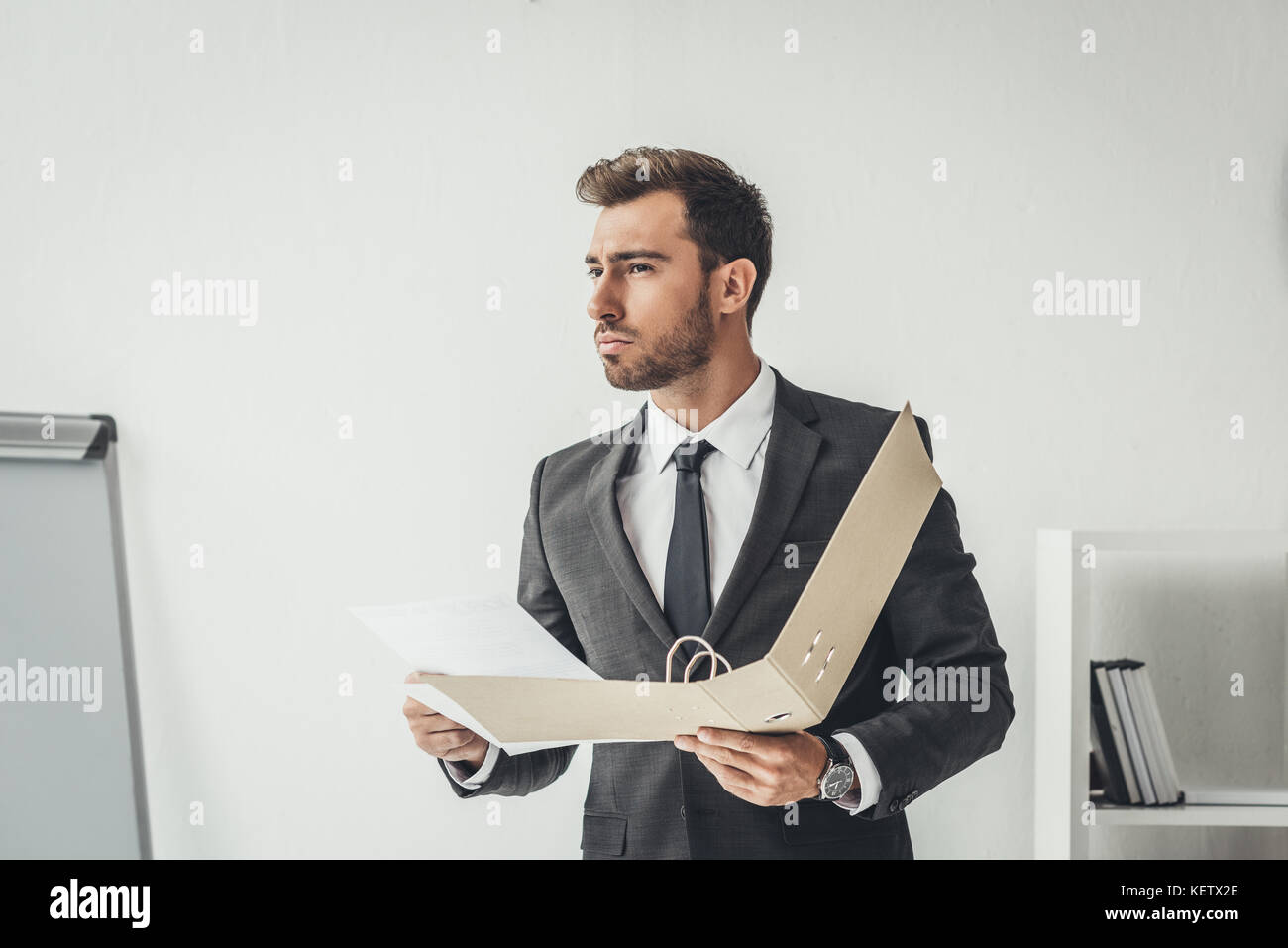 businessman with documents folder Stock Photo - Alamy