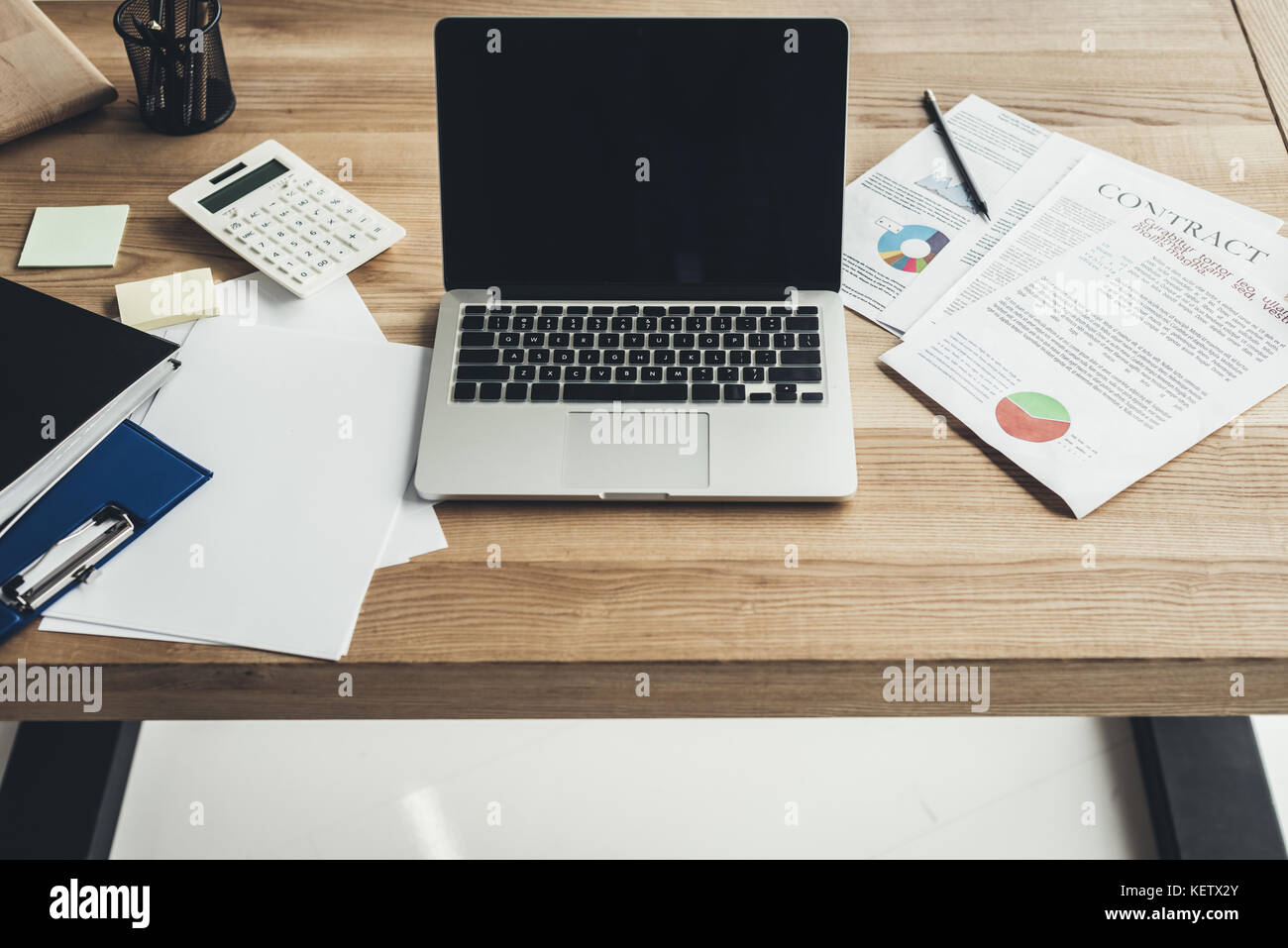 workplace with laptop and documents Stock Photo - Alamy