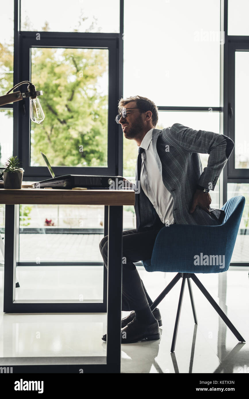 businessman with back pain Stock Photo - Alamy
