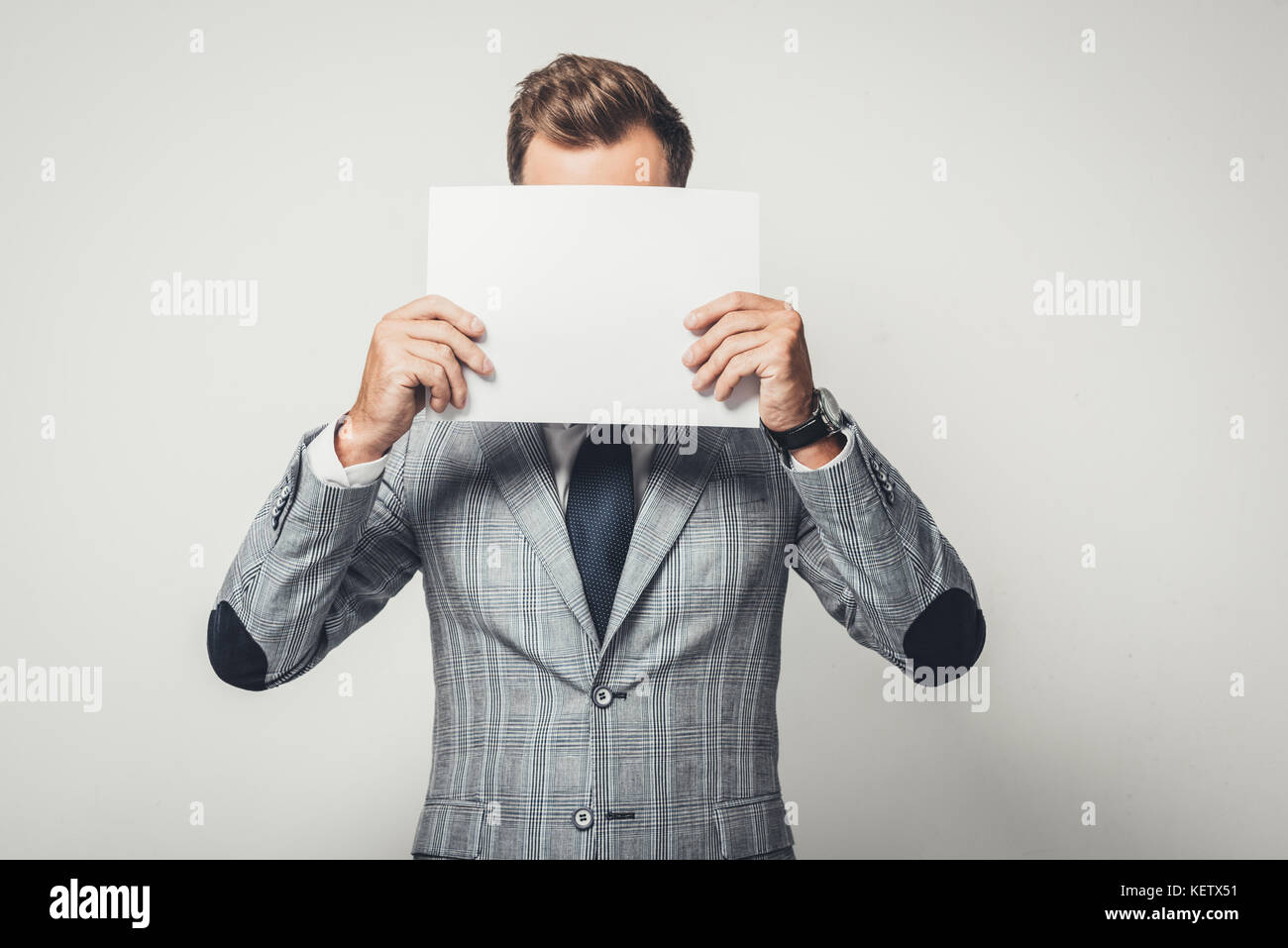 businessman covering face with paper Stock Photo - Alamy
