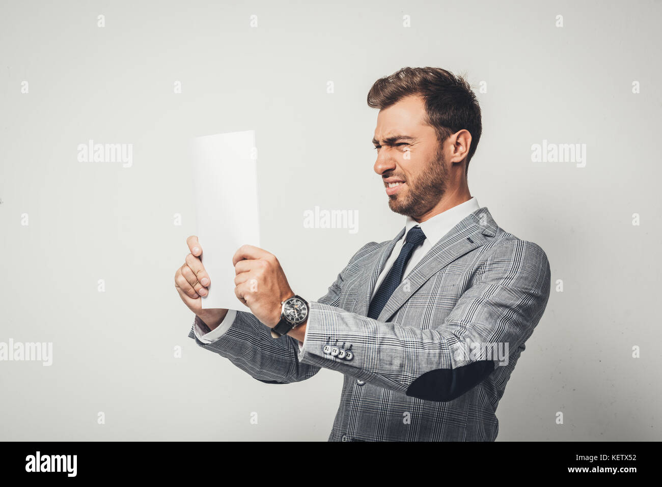 businessman looking at paper Stock Photo - Alamy