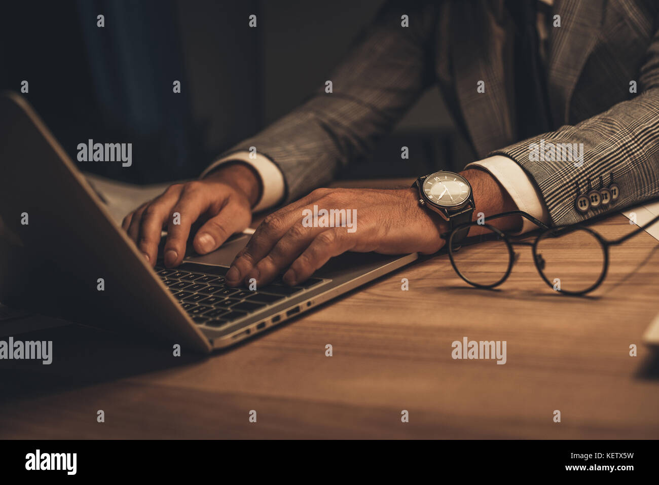 working with laptop Stock Photo - Alamy