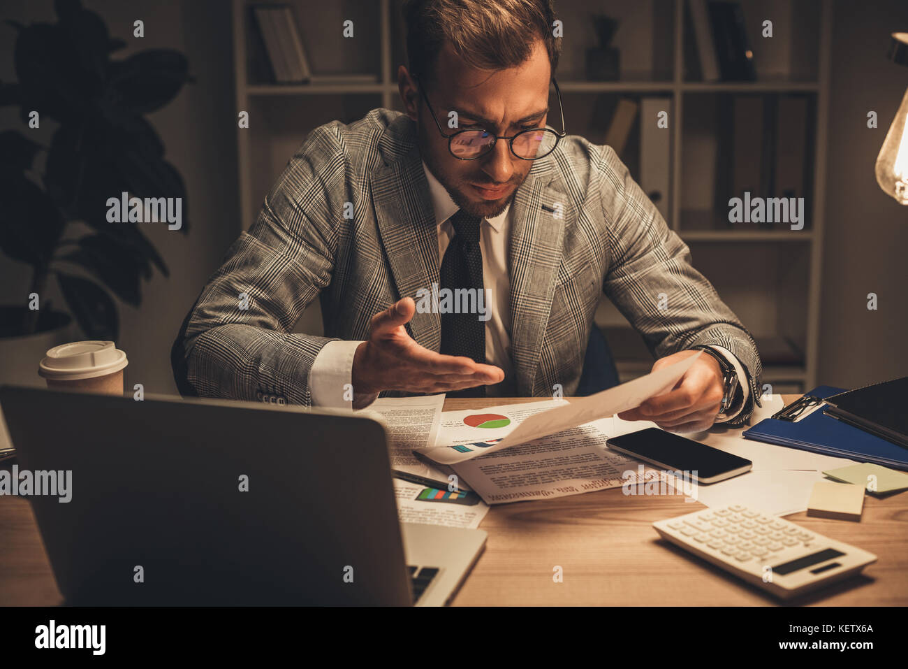 overworked businessman with paperwork Stock Photo - Alamy