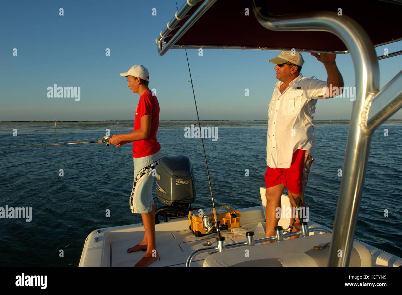 Young boy red drum redfish hi-res stock photography and images - Alamy