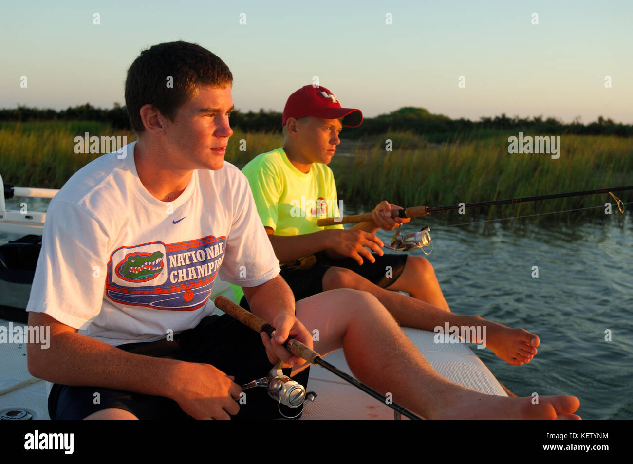 Young kids fishing for redfish or red drum on the bay near Port Aransas ...