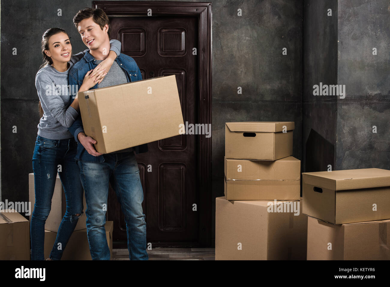 man holding cardboard box Stock Photo - Alamy