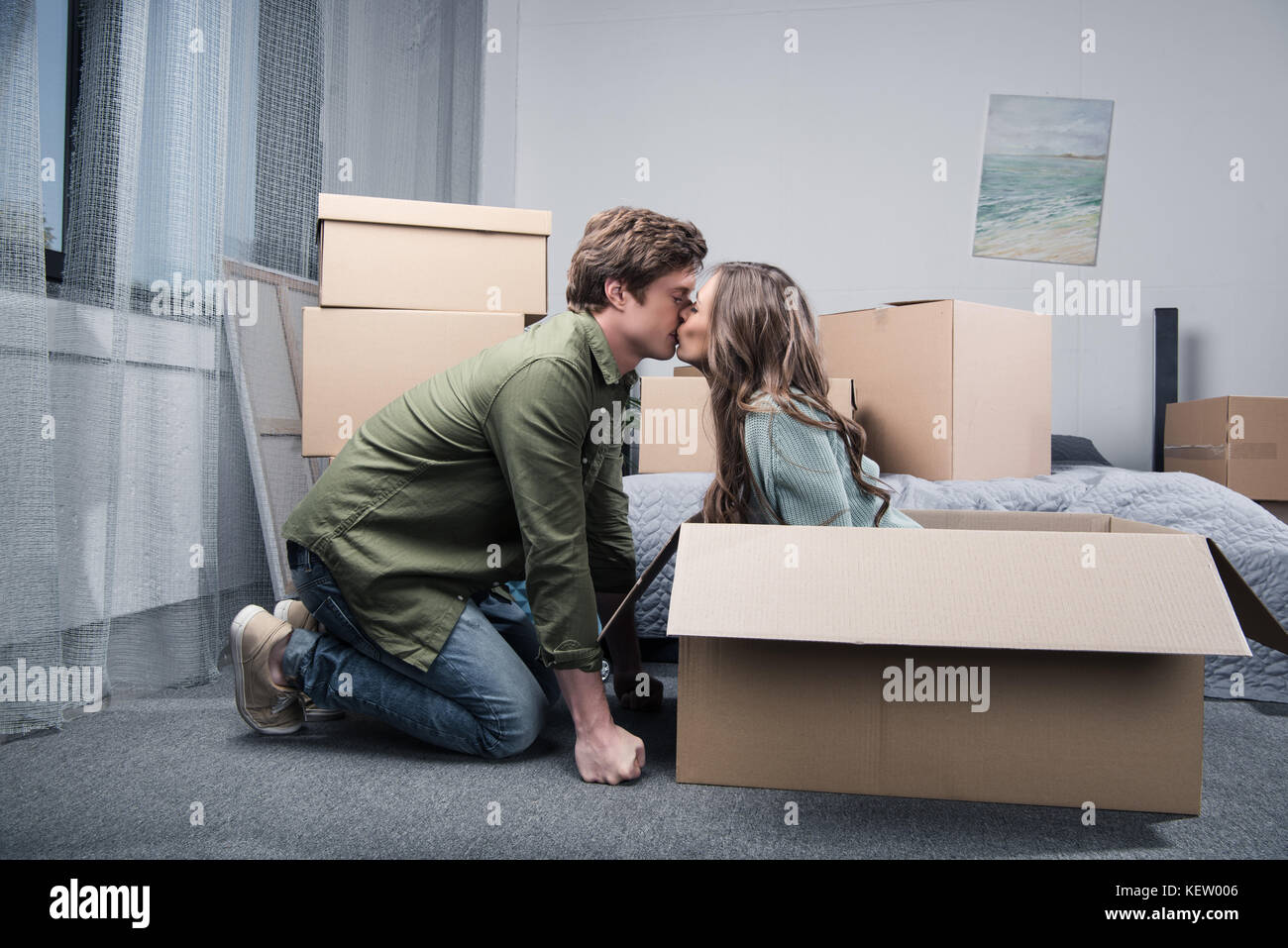 couple kissing at new home Stock Photo - Alamy