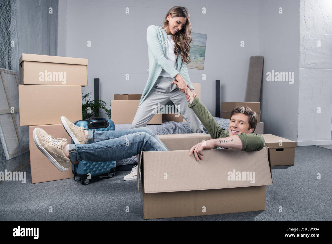 couple having fun at new home Stock Photo - Alamy