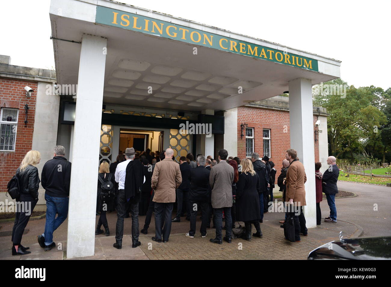 The congregation outside the chapel at the funeral of comedian Sean ...
