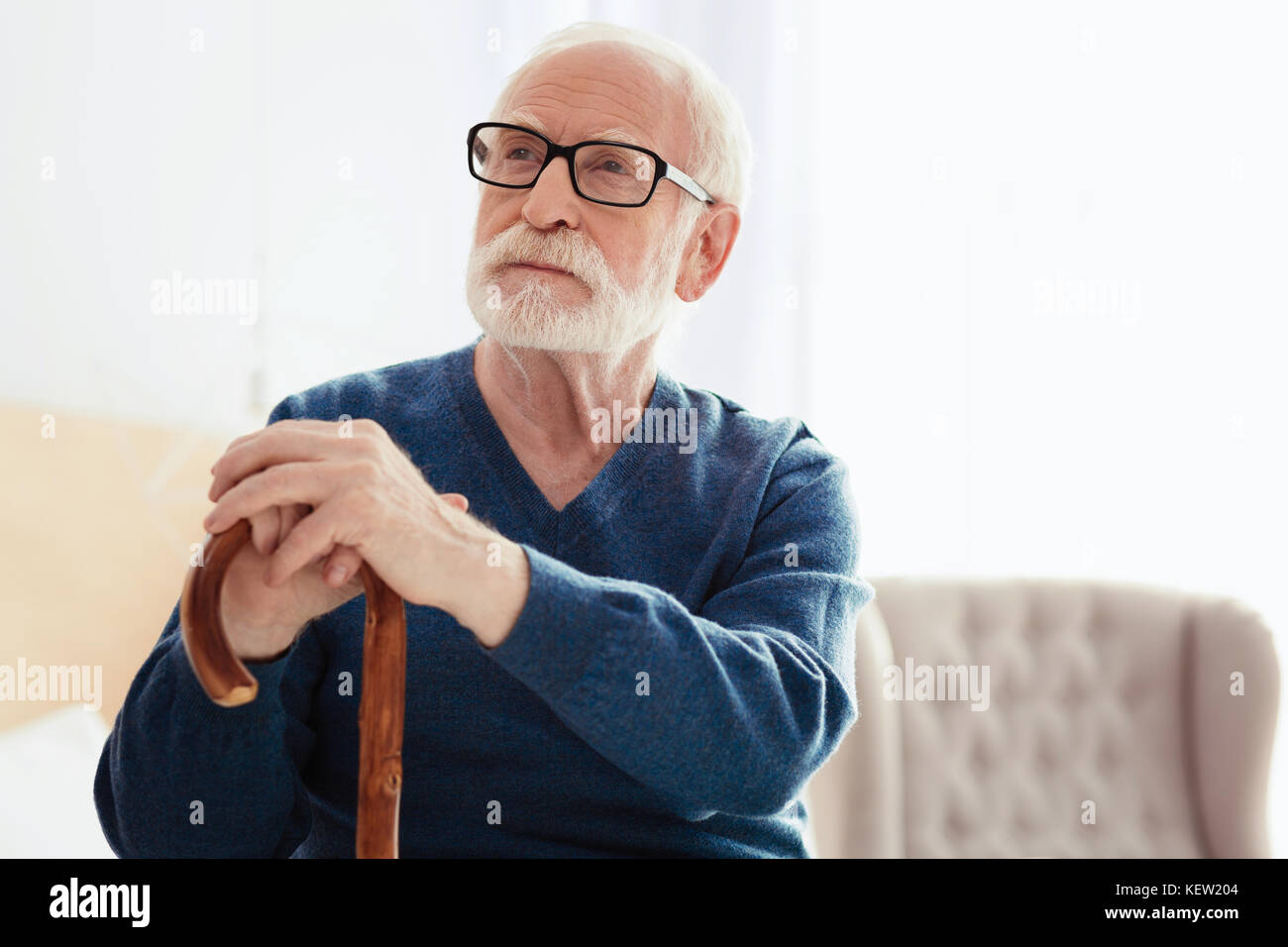 Serious grey-haired man being deep in thoughts Stock Photo - Alamy