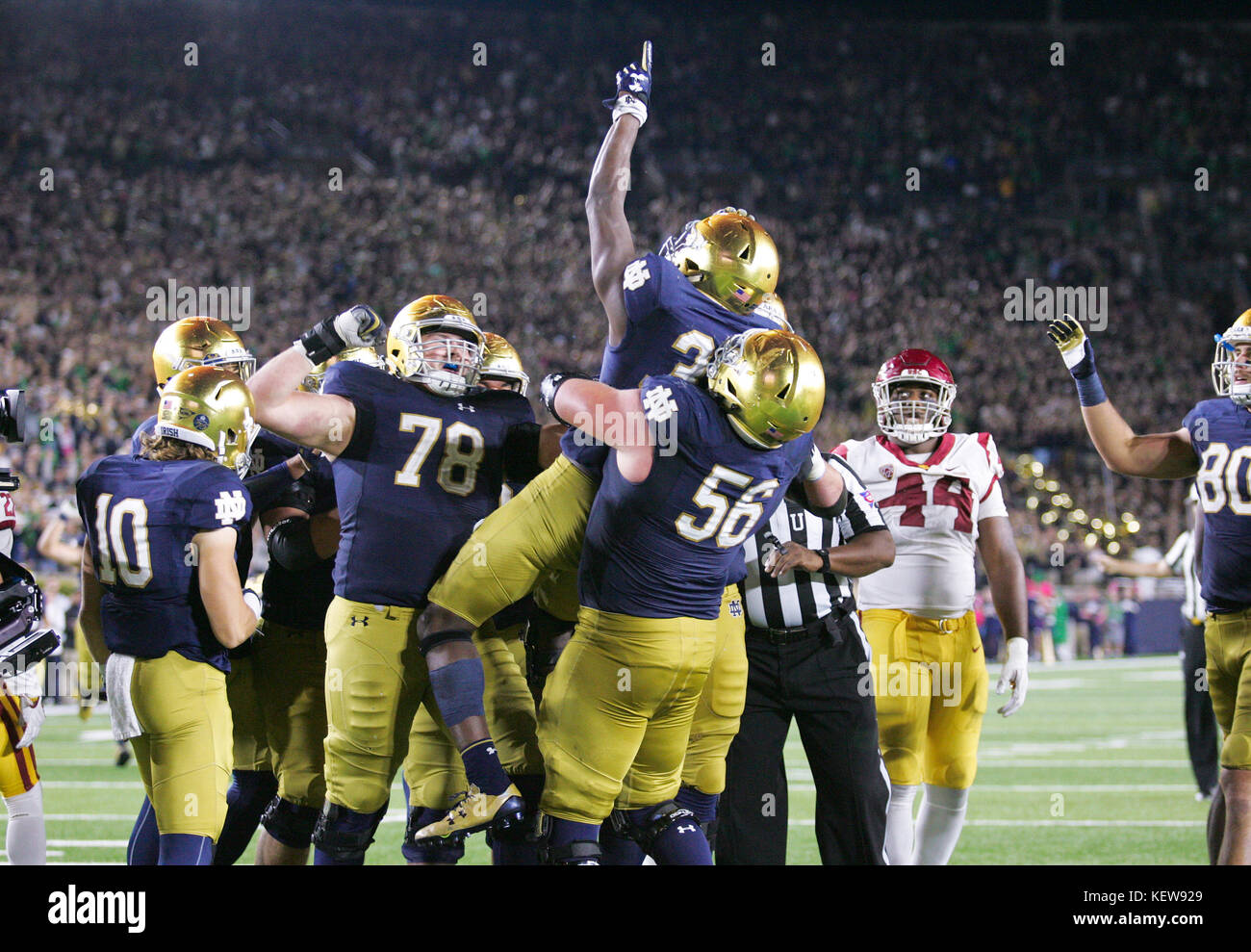 Notre Dame Fighting Irish running back Josh Adams (33) is surrounded by ...