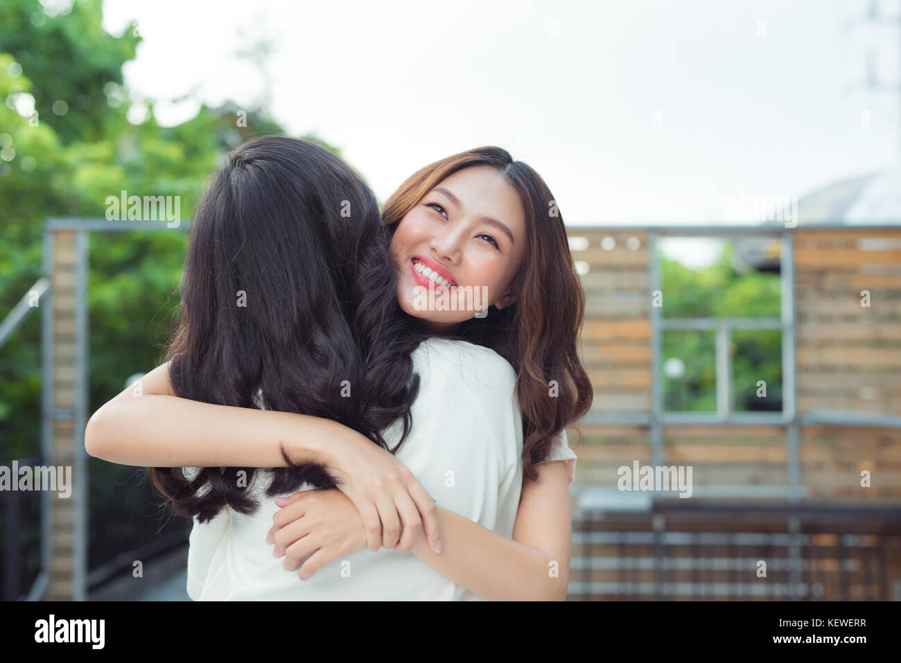 Two sisters hugging hi-res stock photography and images - Alamy