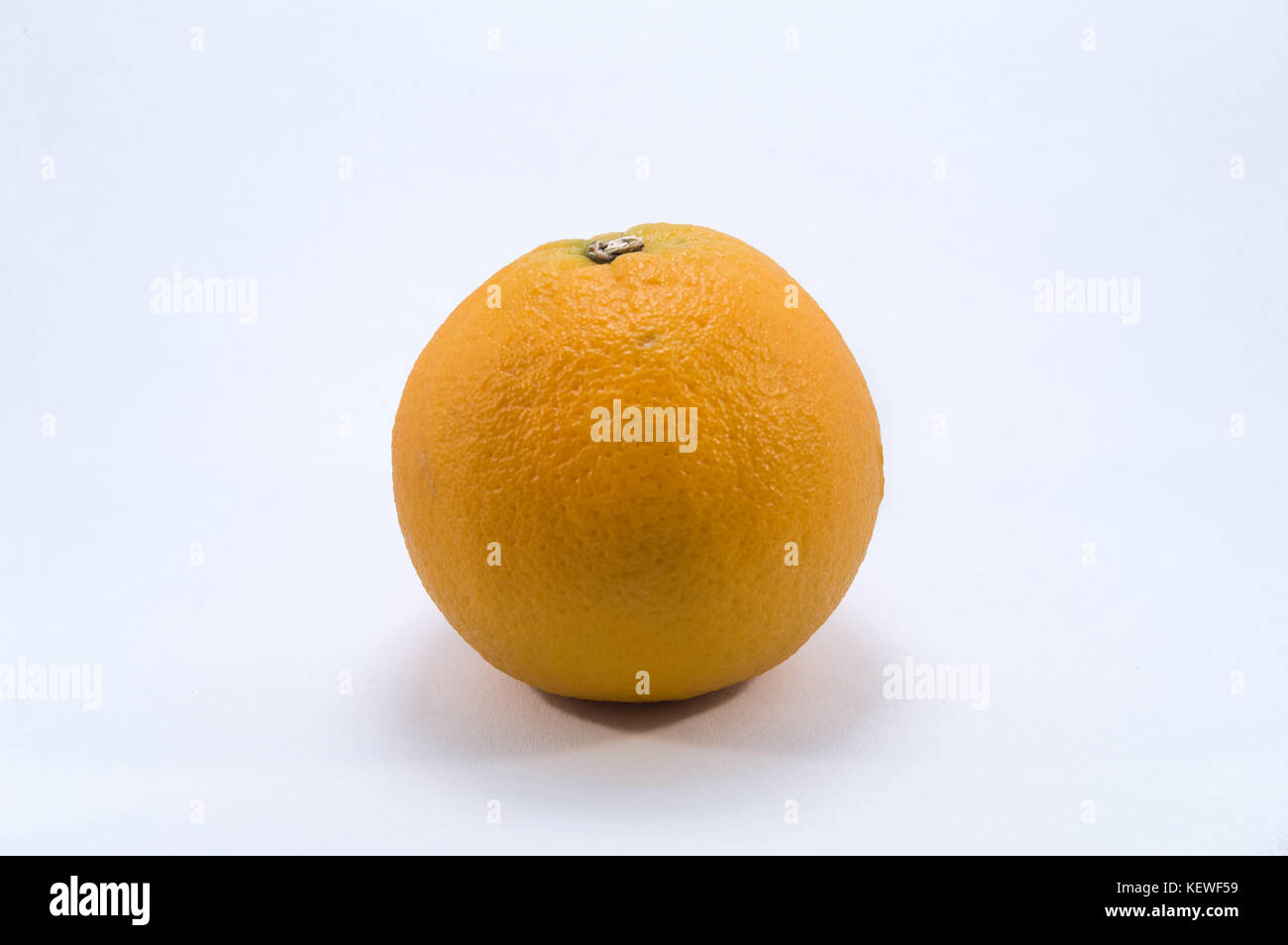 Beautiful orange in closeup on a white background Stock Photo - Alamy