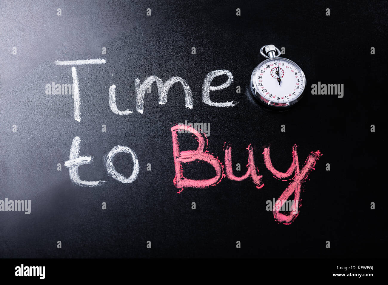 Time To Buy Concept Near Stopwatch On Blackboard Stock Photo - Alamy