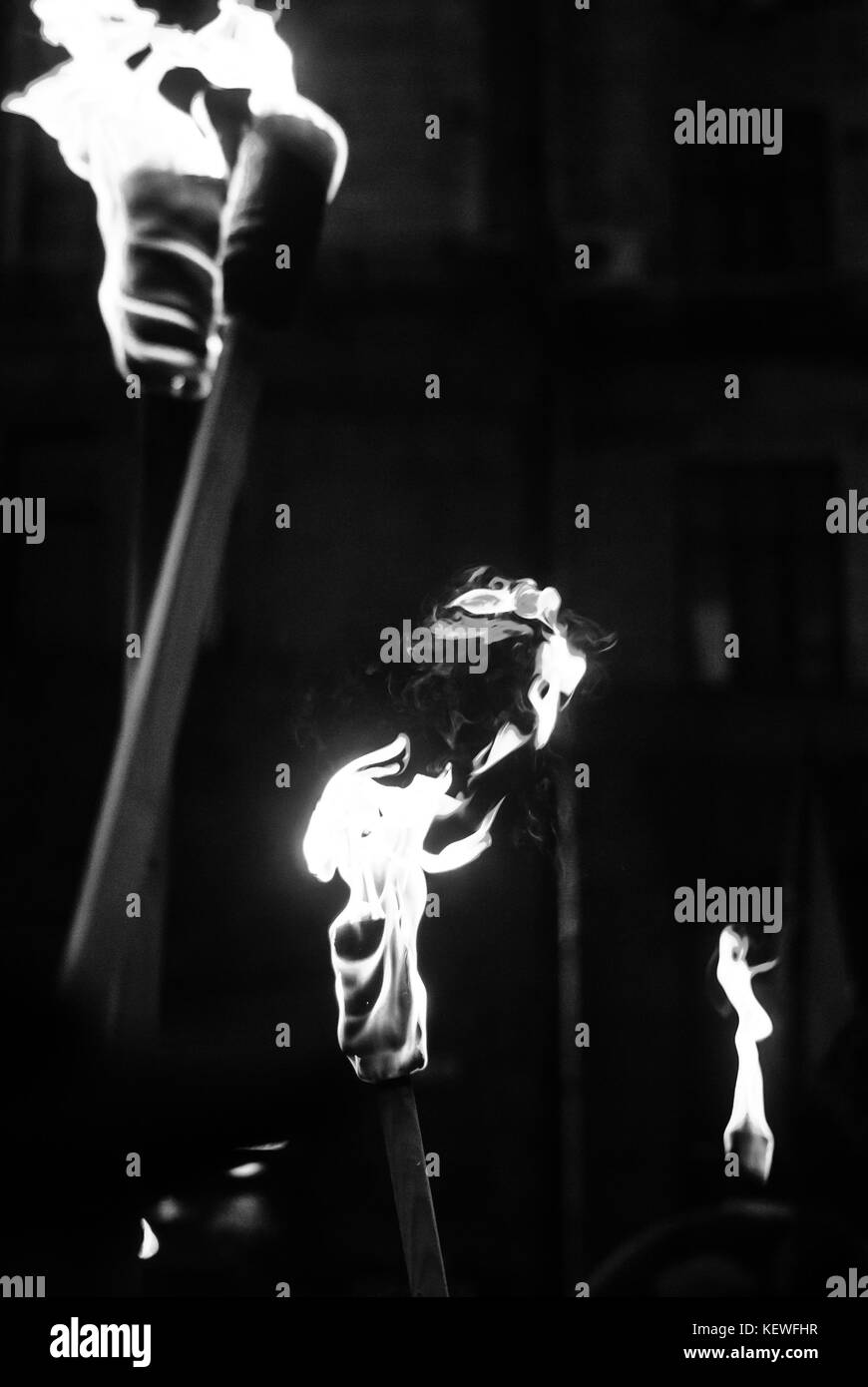 Burning torches in the dark Stock Photo - Alamy
