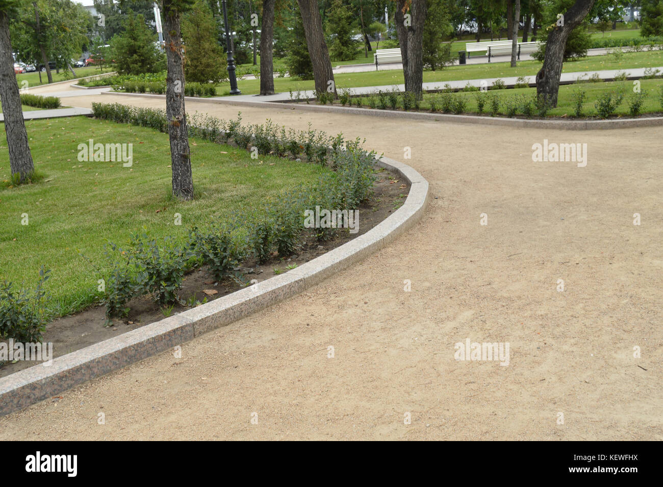 A sandy path for walking in a beautiful Park Stock Photo - Alamy
