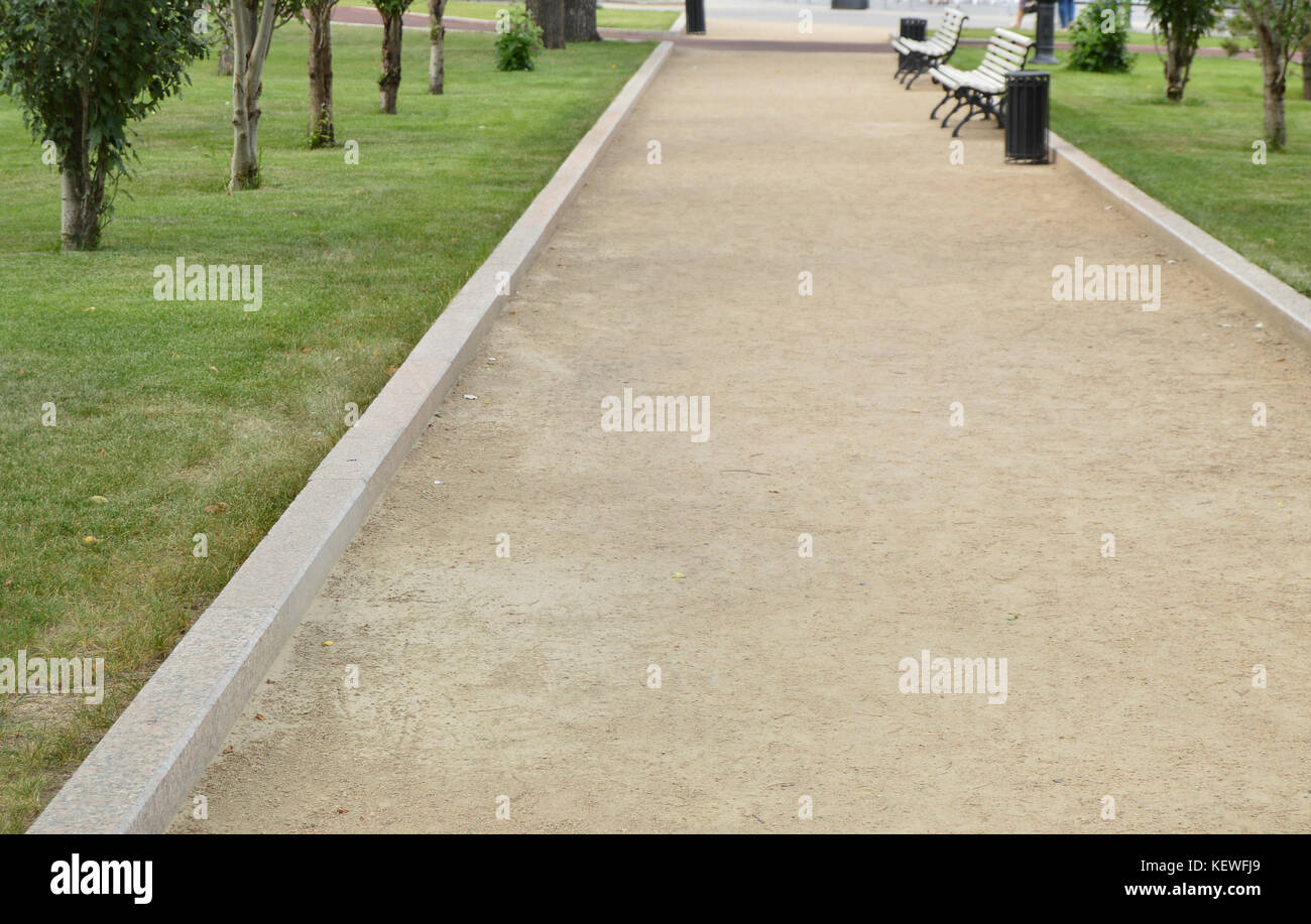 A sandy path for walking in a beautiful Park Stock Photo - Alamy