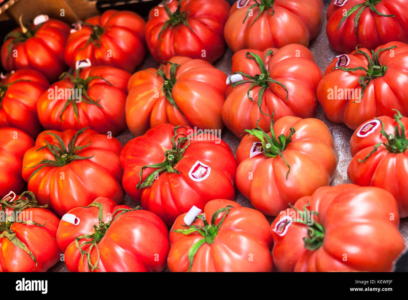 Close-up of large pink Monterosa tomatoes for sale. Palma, Mallorca ...
