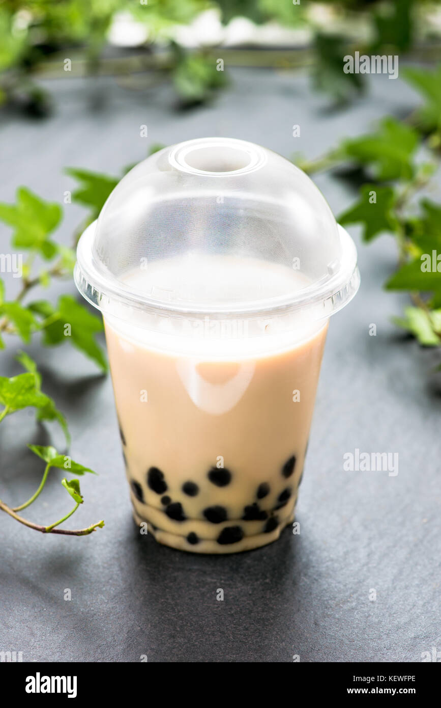 Bubble boba tea with milk and tapioca pearls in plastic cup Stock Photo ...