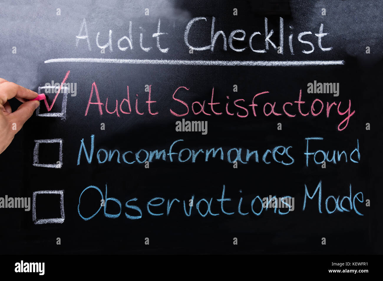 Close-up Of Person's Hand Marking On Checklist With Chalk Stock Photo ...