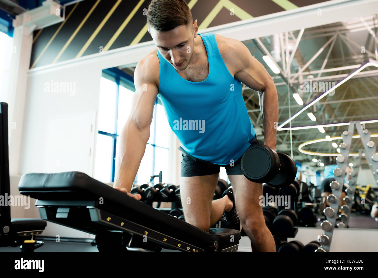 Handsome Man Working Out with Dumbbells Stock Photo - Alamy