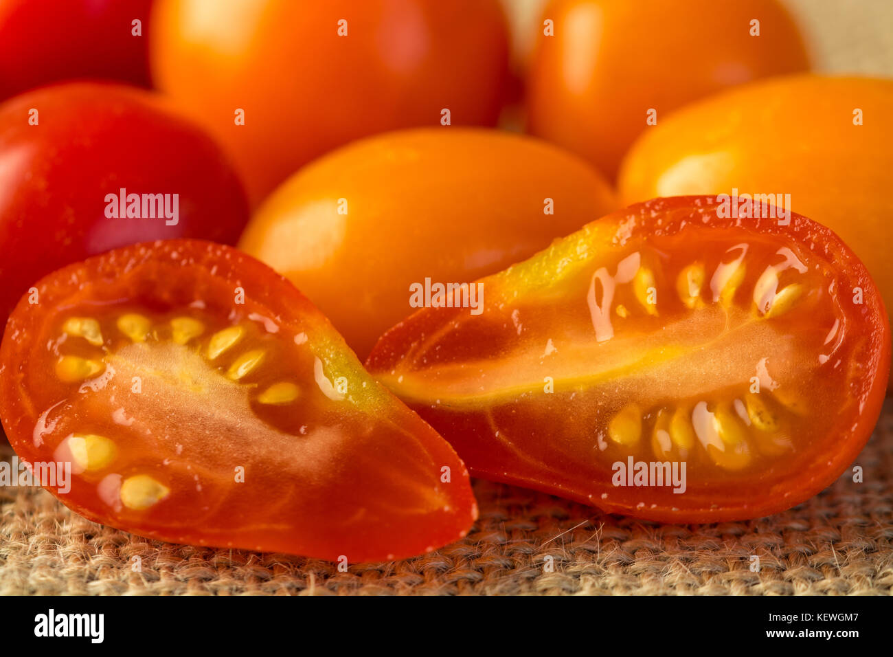 tomato open in half on sepia background Stock Photo - Alamy
