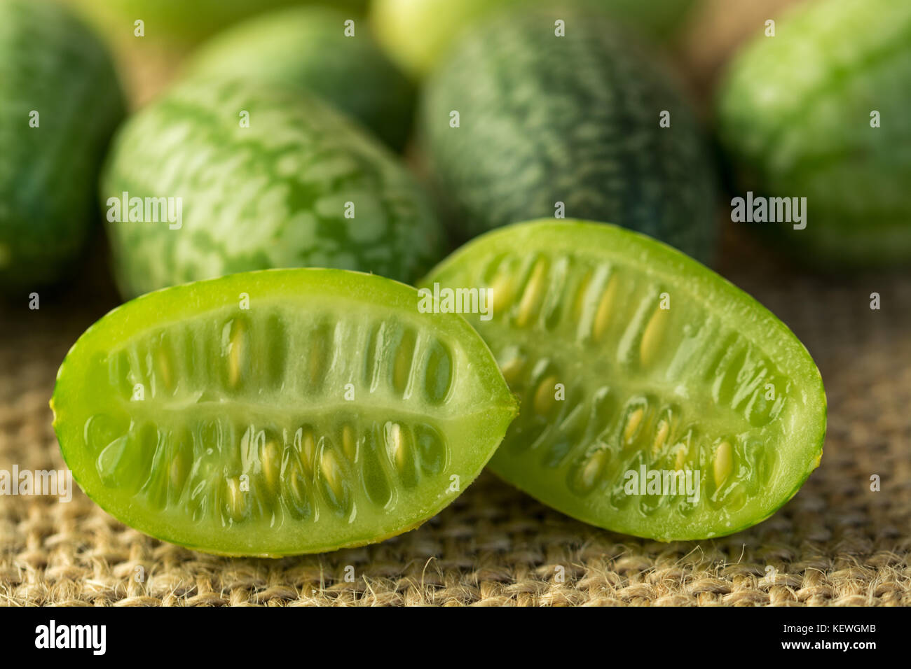 mini cocumber open in half on sepia background Stock Photo - Alamy