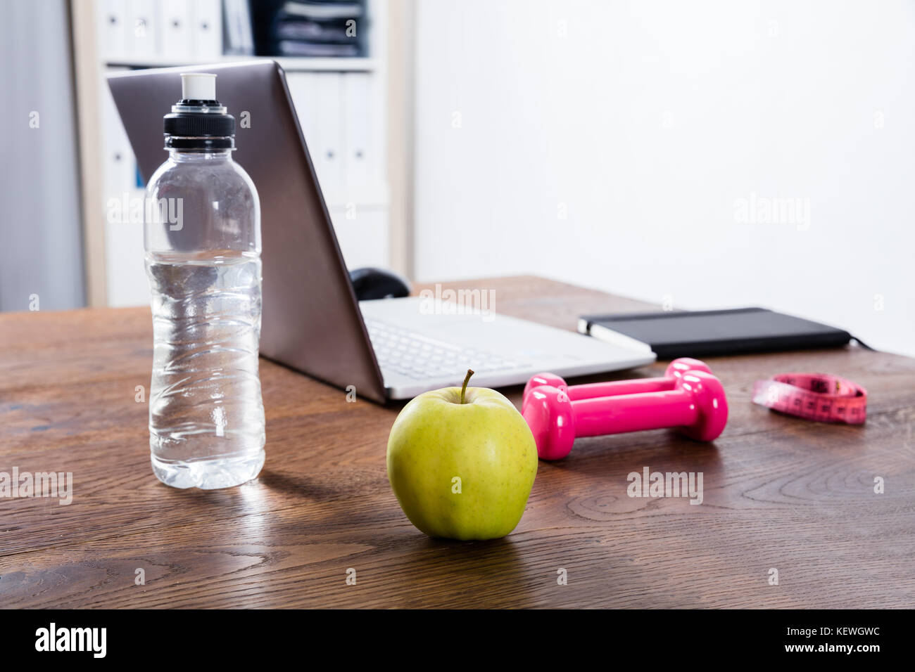 Close-up Of A Fitness Object Near Laptop On Wooden Desk Stock Photo - Alamy