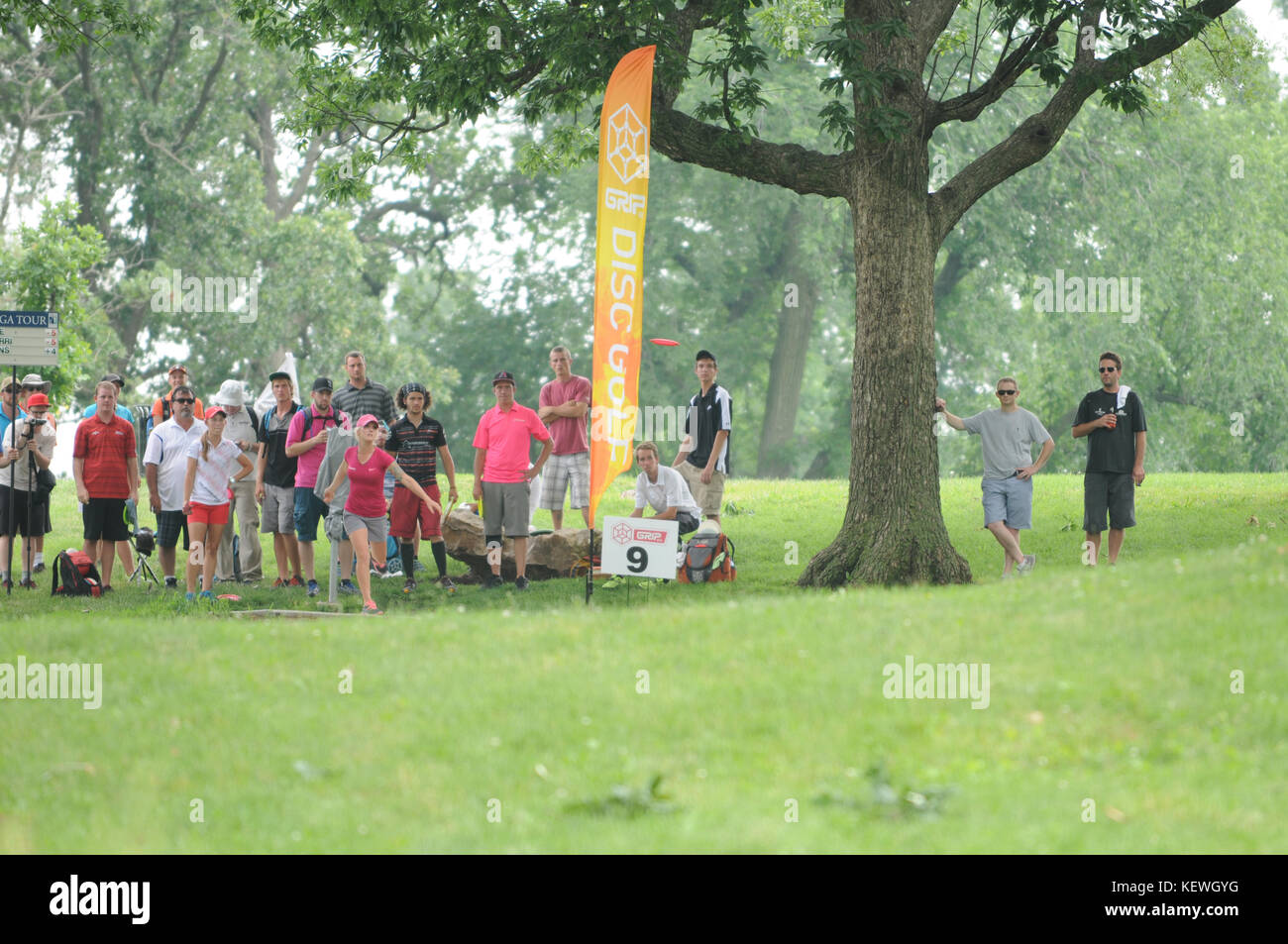 Disc Golf drive down the fairway with spectators Stock Photo - Alamy